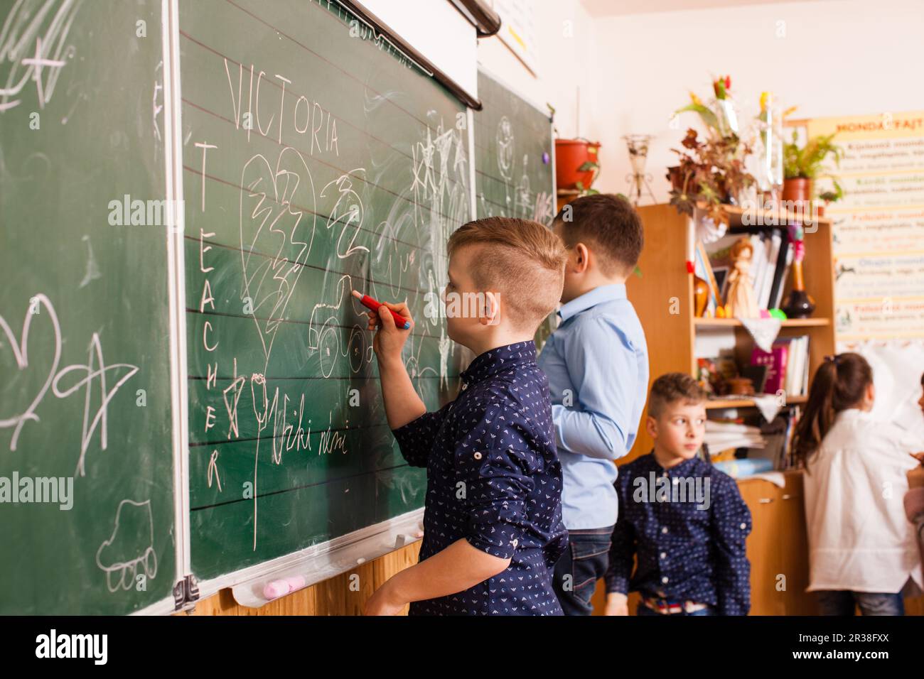 Boys want to draw something special Stock Photo - Alamy