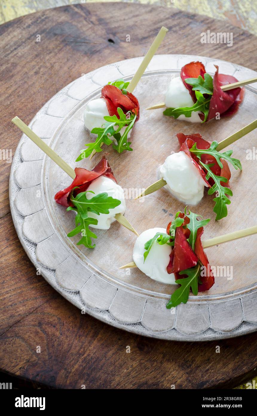 Buffalo mozzarella bites with bresaola and fresh rocket leaves canapes ...