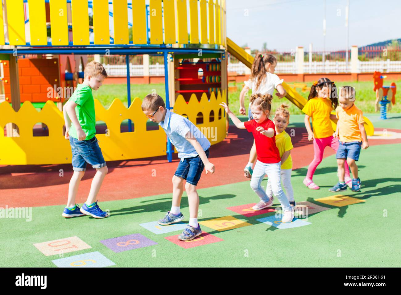 Group of kids play hopscotch Stock Photo - Alamy