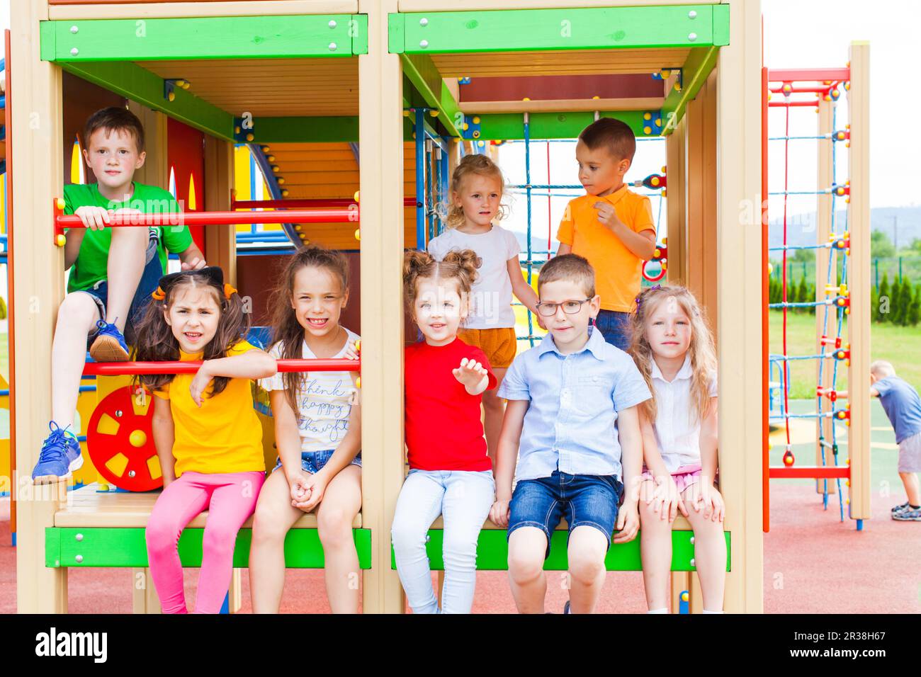 Group of children on playground Stock Photo - Alamy