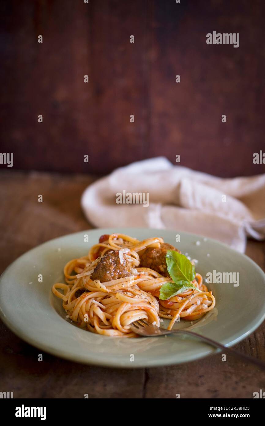 Linguine with meatballs in tomato sauce Stock Photo - Alamy