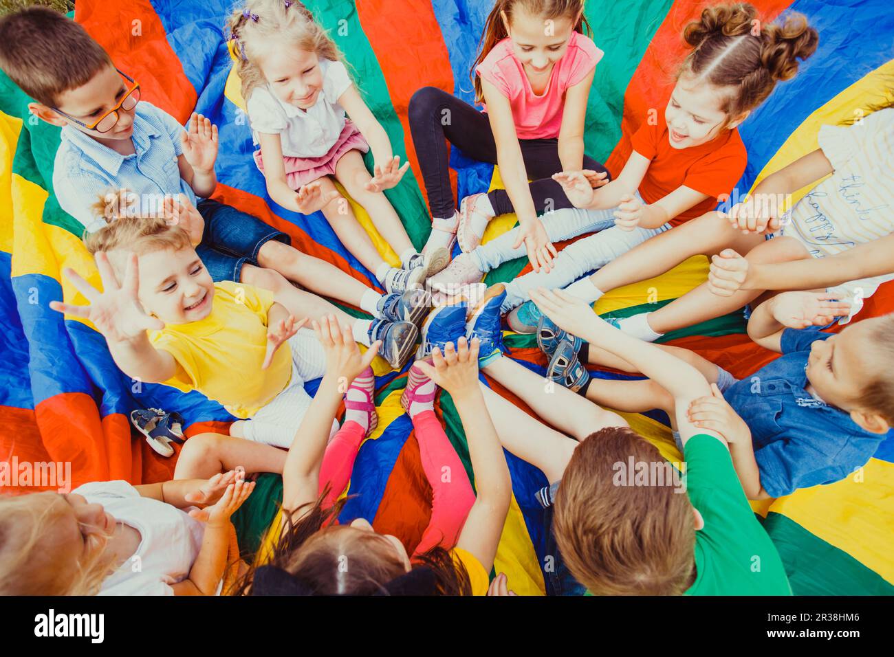 Kids holding hands together Stock Photo - Alamy