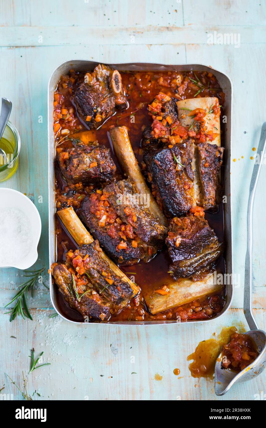 Italian style ribs in a roasting tin Stock Photo - Alamy