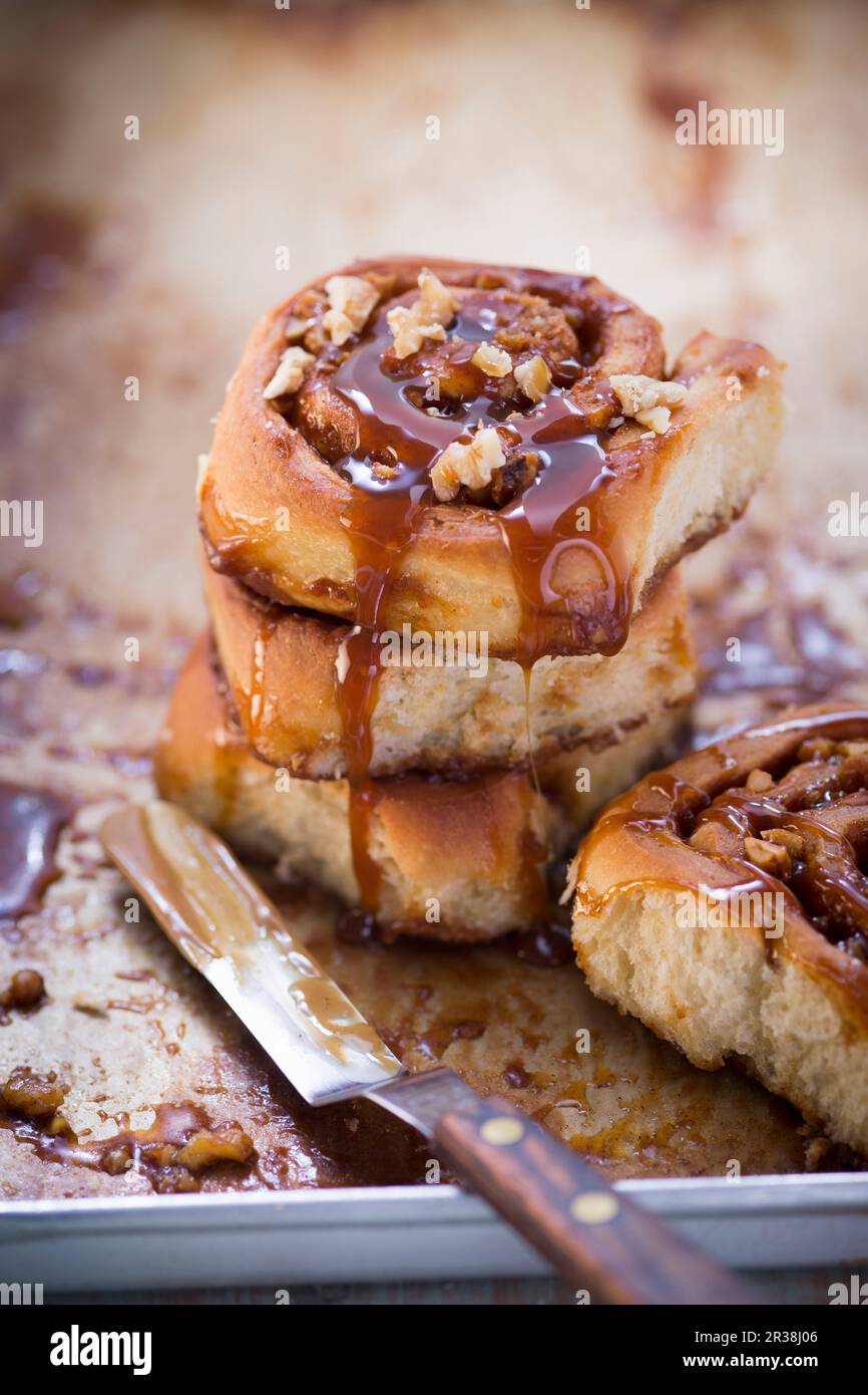 Cinnamon rolls with chopped nuts and caramel sauce Stock Photo - Alamy