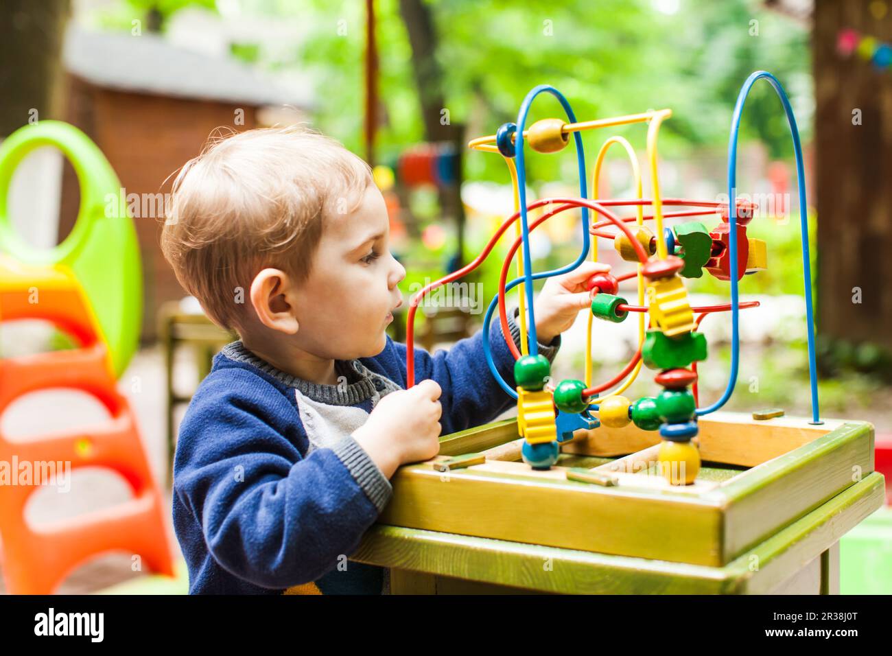 Little kid boy plays Stock Photo - Alamy