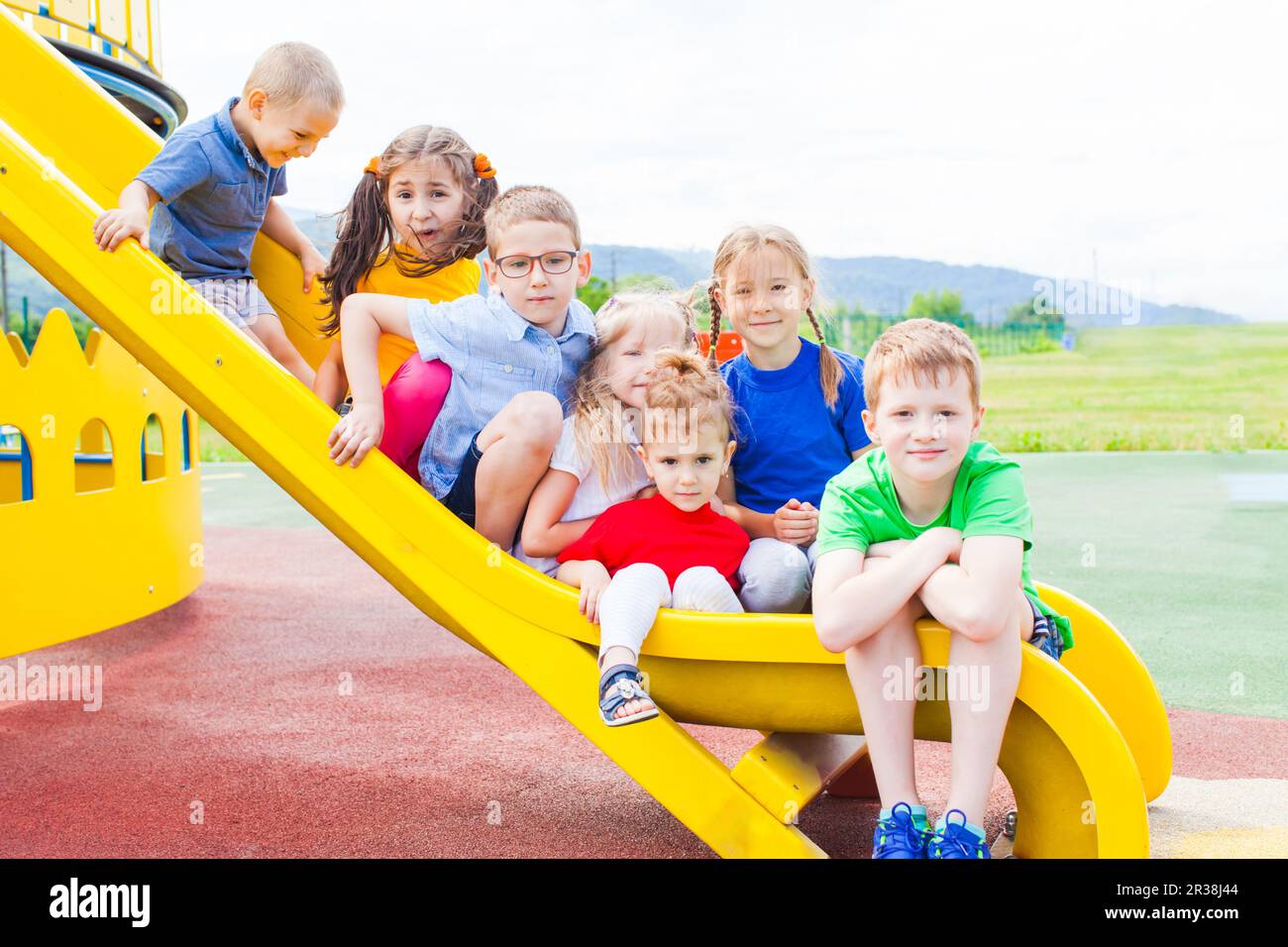 Children have fun on the slide Stock Photo - Alamy
