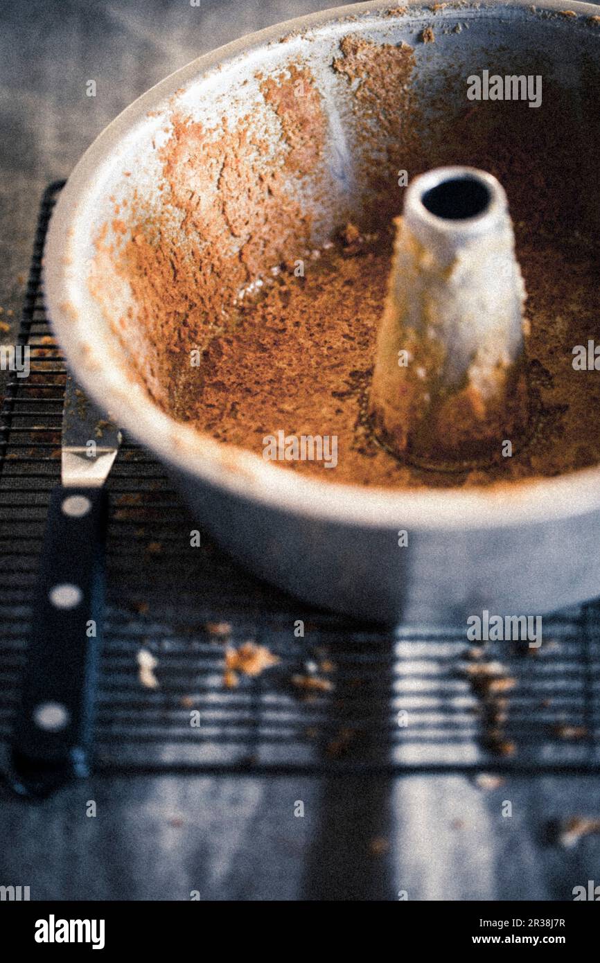 The remains of pound cake in a baking tin Stock Photo - Alamy