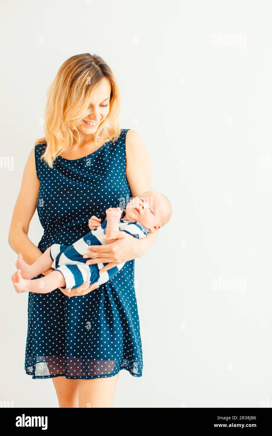 Calm and peacefull mother looking at her child Stock Photo - Alamy