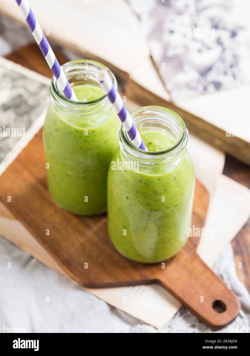 Green vegan smoothie in two small bottles Stock Photo - Alamy