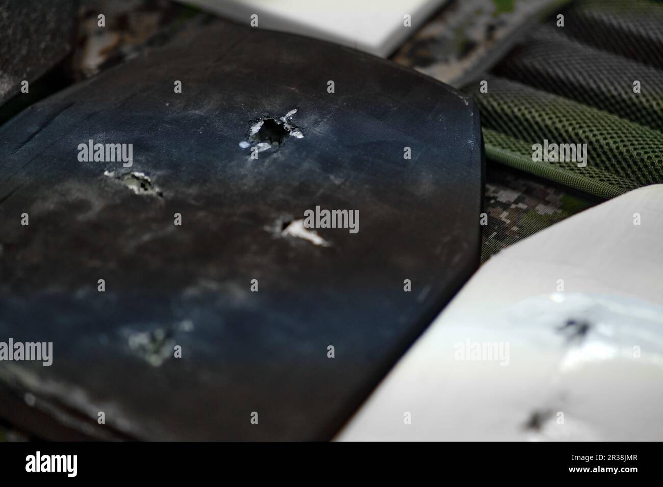 The armored panels of a ballistic vest designed to absorb and deflect ...