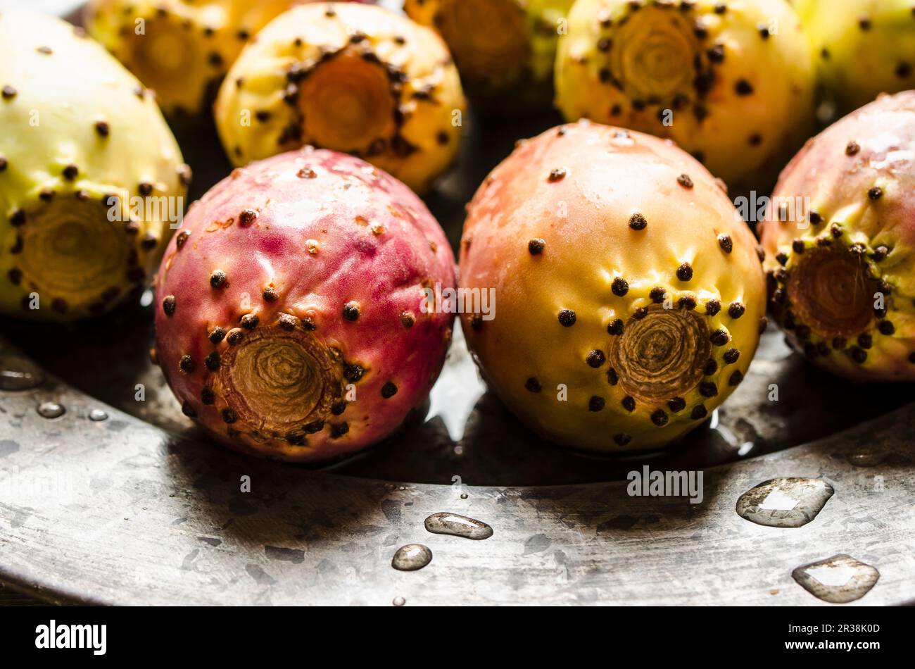 Prickly pears on metal plate (Indian figs Stock Photo - Alamy