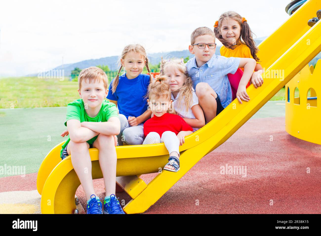 Kids have fun on the slide Stock Photo - Alamy