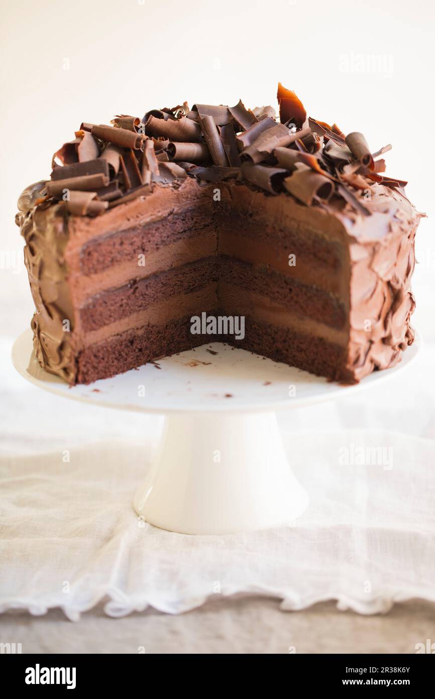A three-layer chocolate cream cake, sliced Stock Photo - Alamy