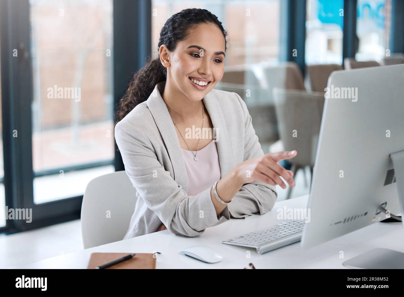 Computer, success and businesswoman working in the office while reading ...