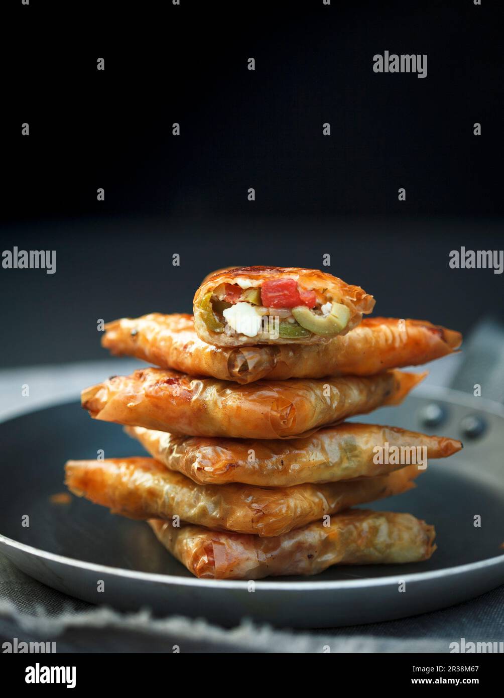 A stack of stuffed filo pastry parcels Stock Photo - Alamy