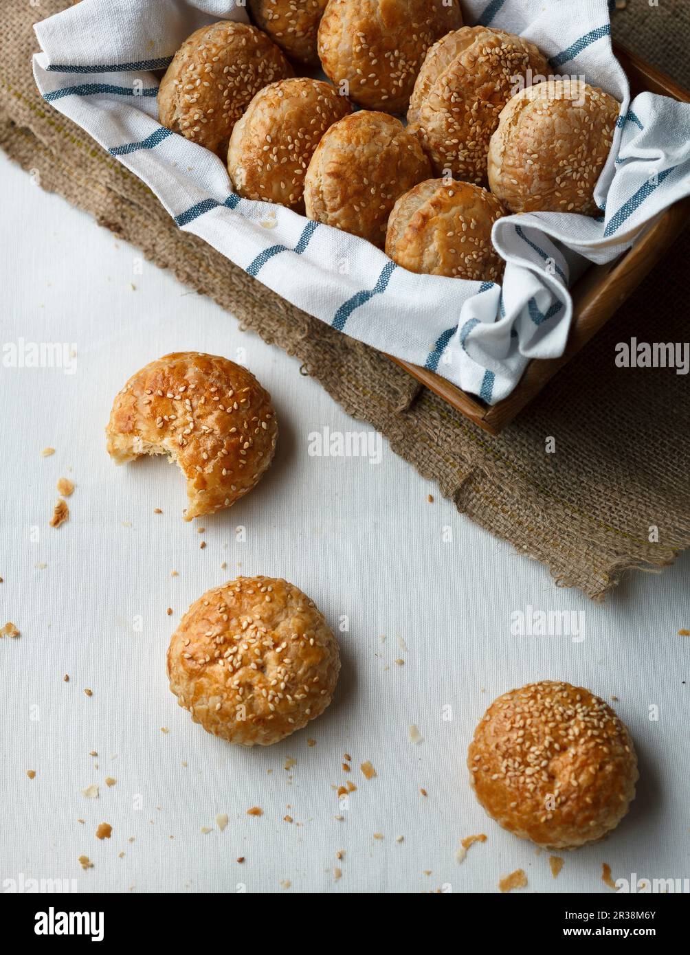 Sesame seed rolls in a bread basket Stock Photo - Alamy