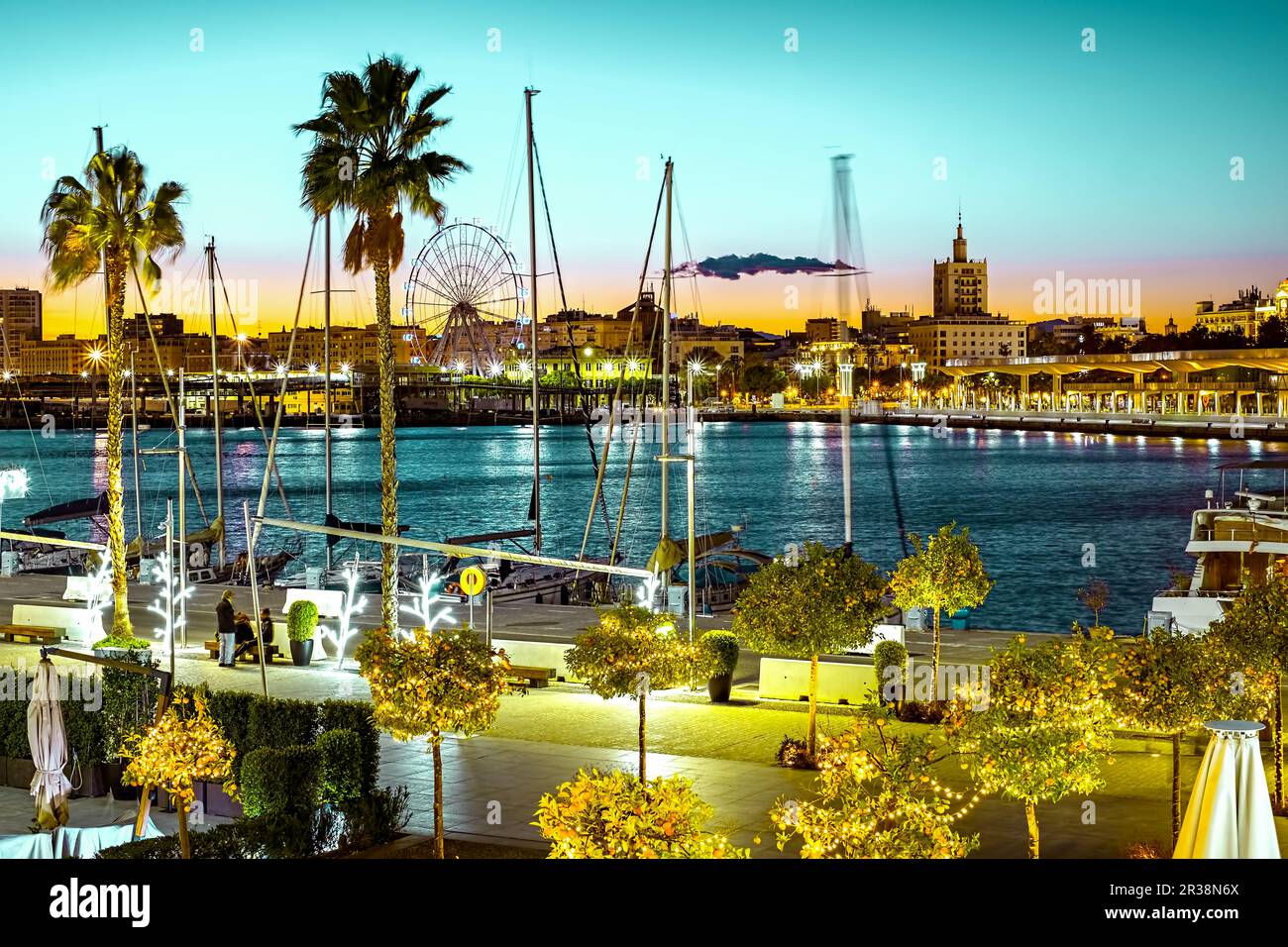 Malaga port and Ferris wheel Stock Photo - Alamy