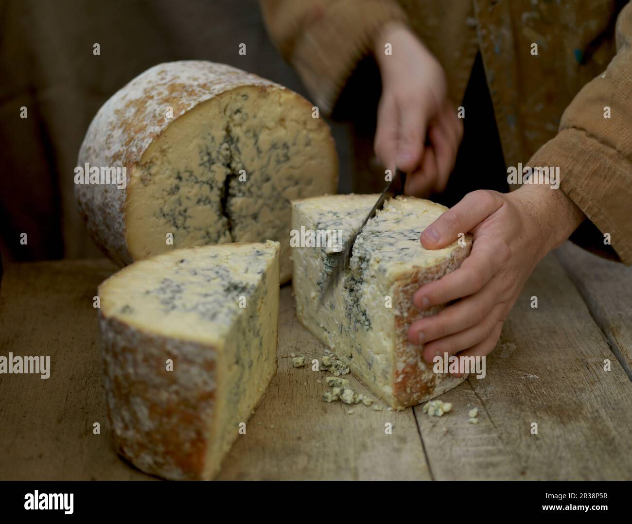 A wheel of Stilton, sliced Stock Photo - Alamy