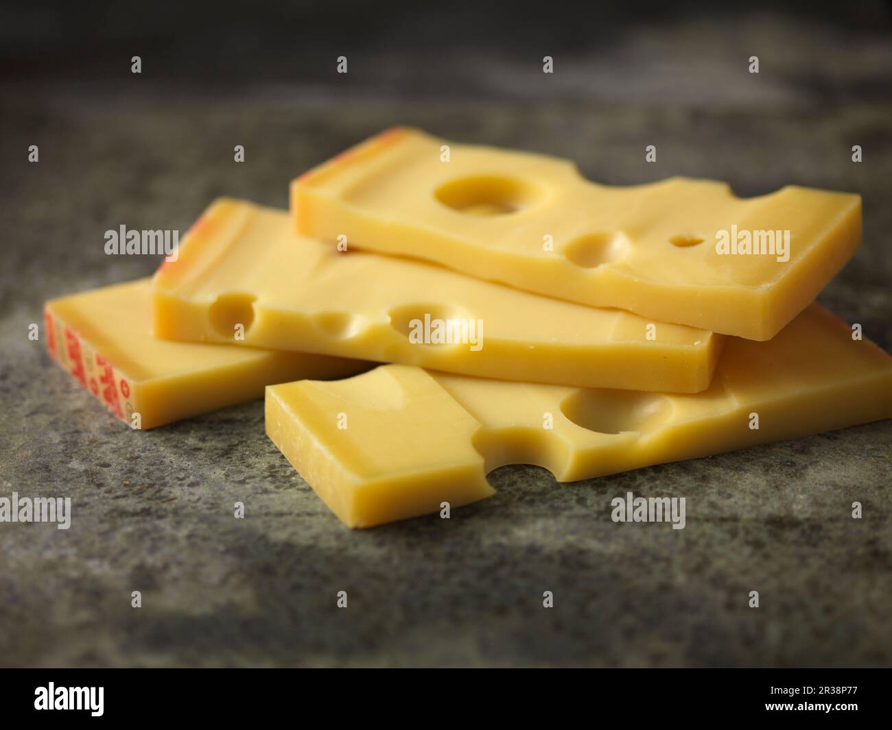 Thick slices of Swiss Emmental Stock Photo - Alamy