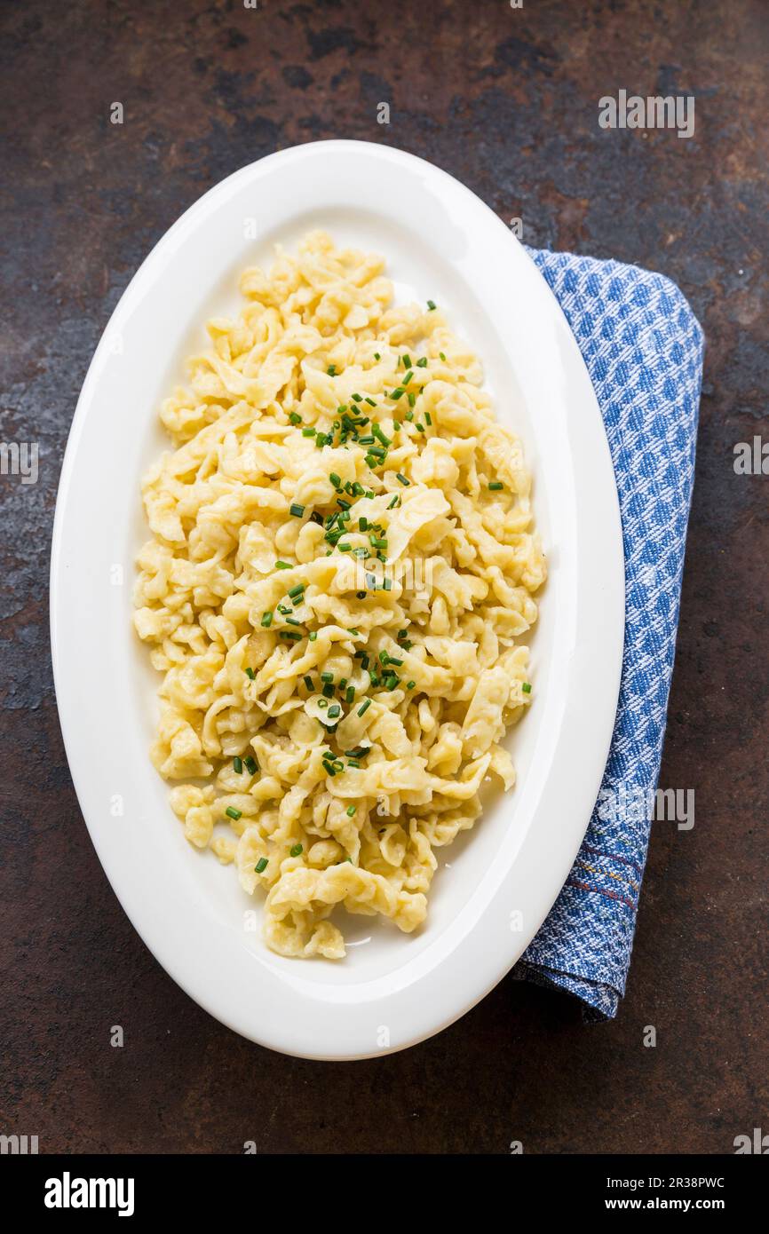 Spätzle noodles with chives Stock Photo - Alamy