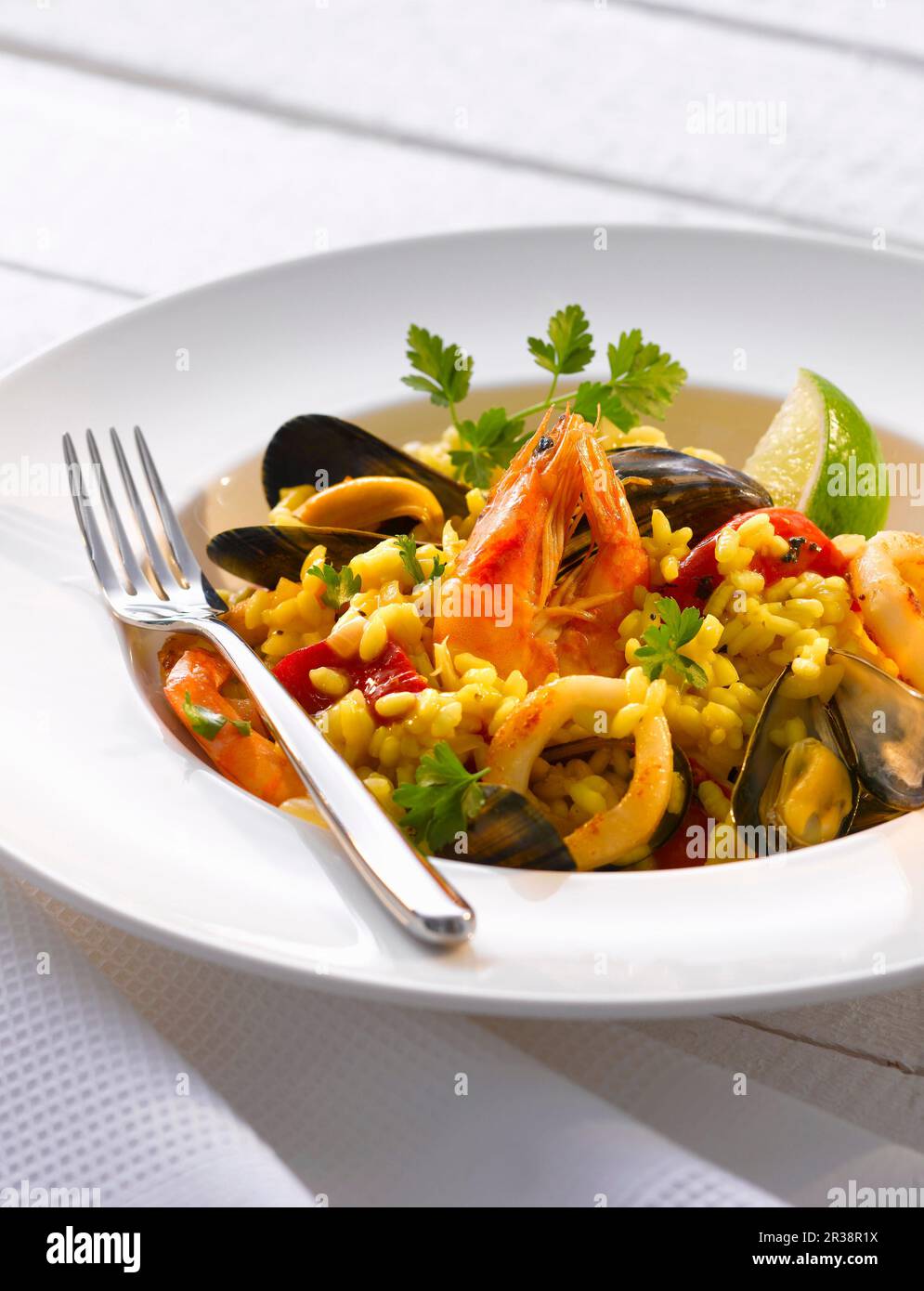 Seafood risotto with lime Stock Photo - Alamy