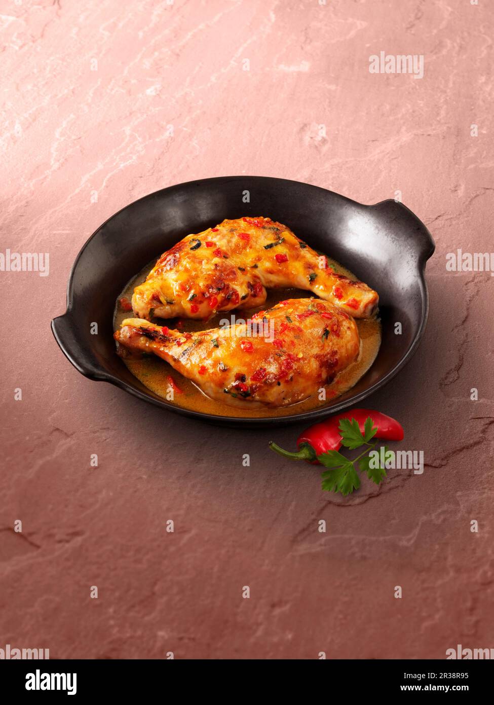 Chicken legs in chili sauce Stock Photo - Alamy