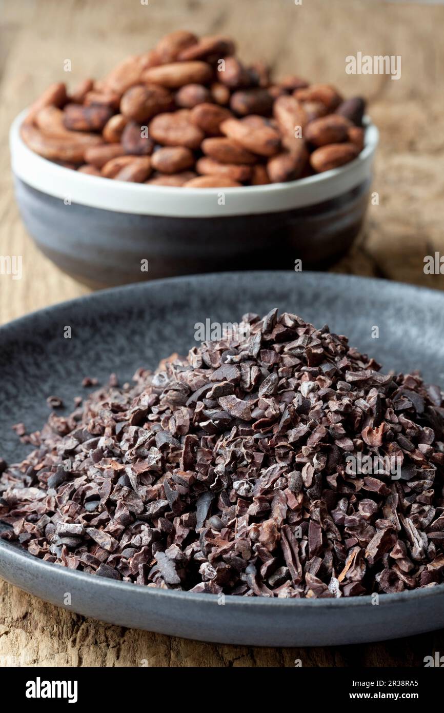 Cocoa bean pieces and cocoa beans Stock Photo - Alamy