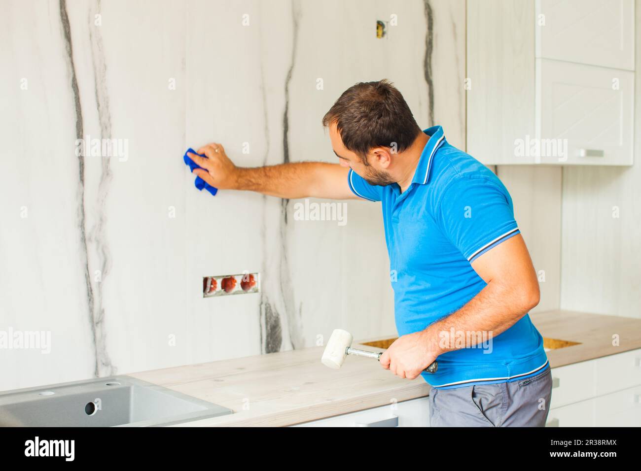 Man house wall repair hi-res stock photography and images - Alamy