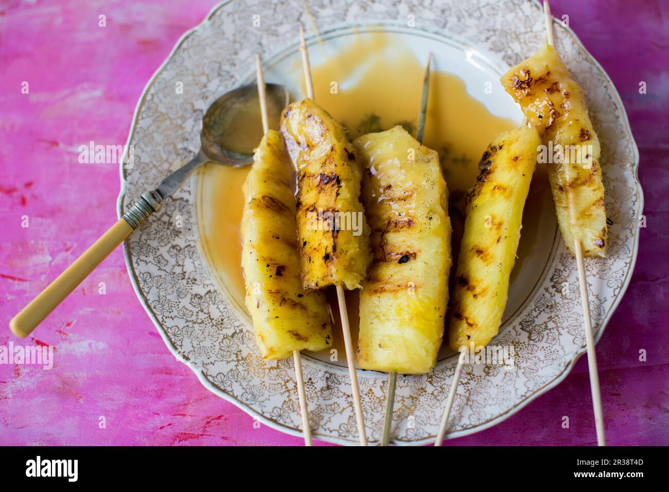 Grilled pineapple kebab with caramel sauce Stock Photo - Alamy