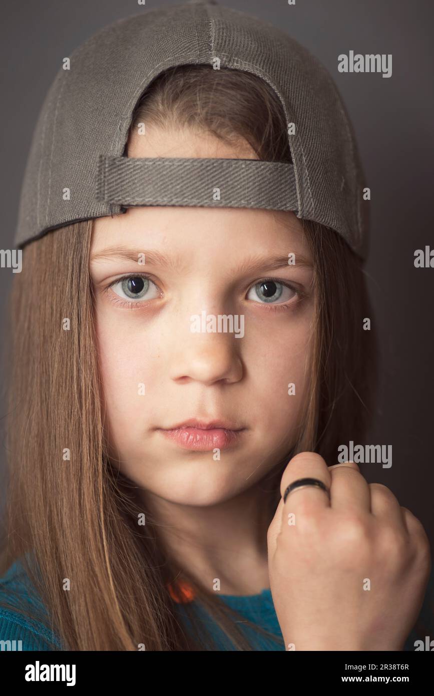 serious child girl portrait showing fist, ready to action Stock Photo ...