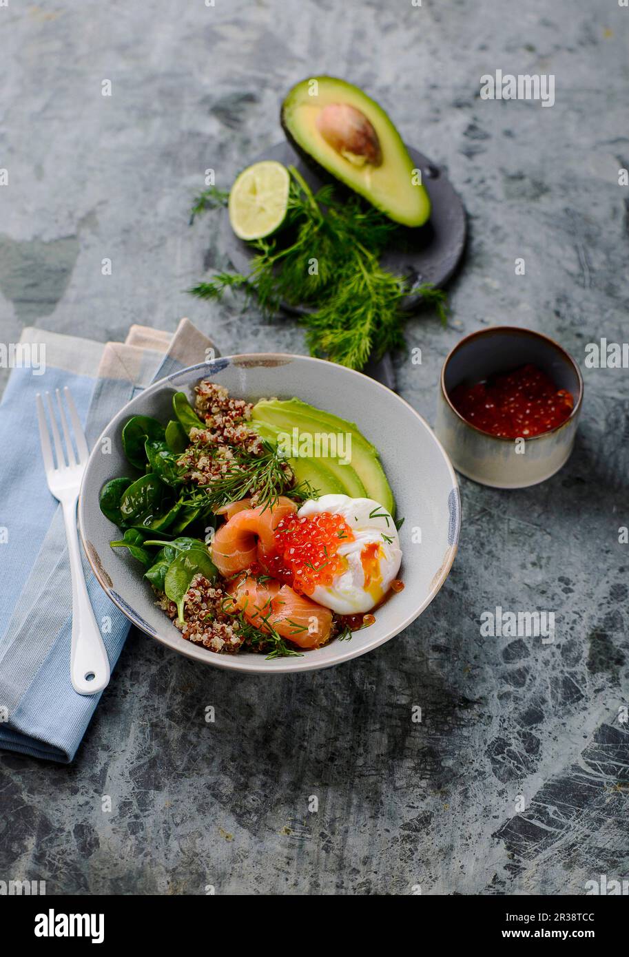 Quinoa salad with spinach, avocado, salmon and caviar Stock Photo - Alamy