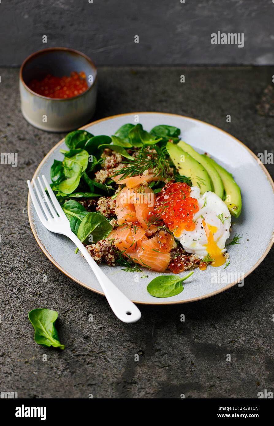 Quinoa salad with spinach, avocado, salmon and caviar Stock Photo - Alamy