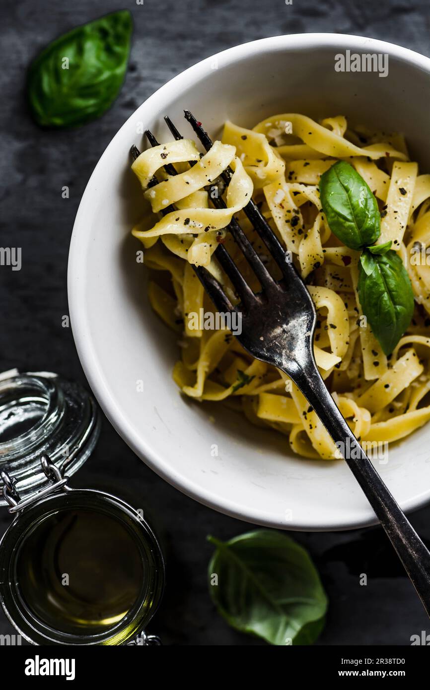 Fettuccine pasta with lemon and basil sauce. Sprinkle with parmesan and ...