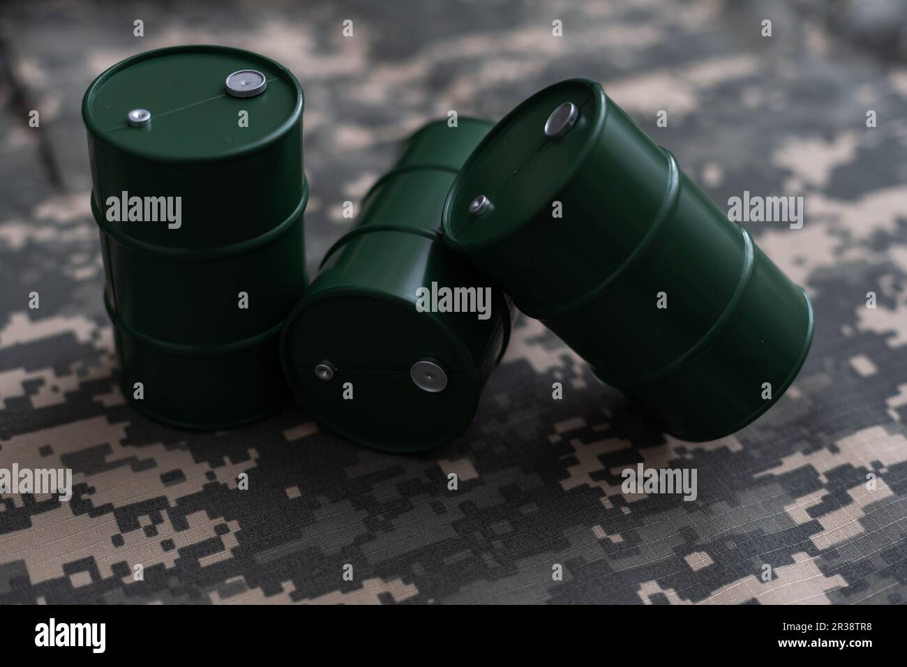 a military uniform and a toy barrel oil Stock Photo - Alamy