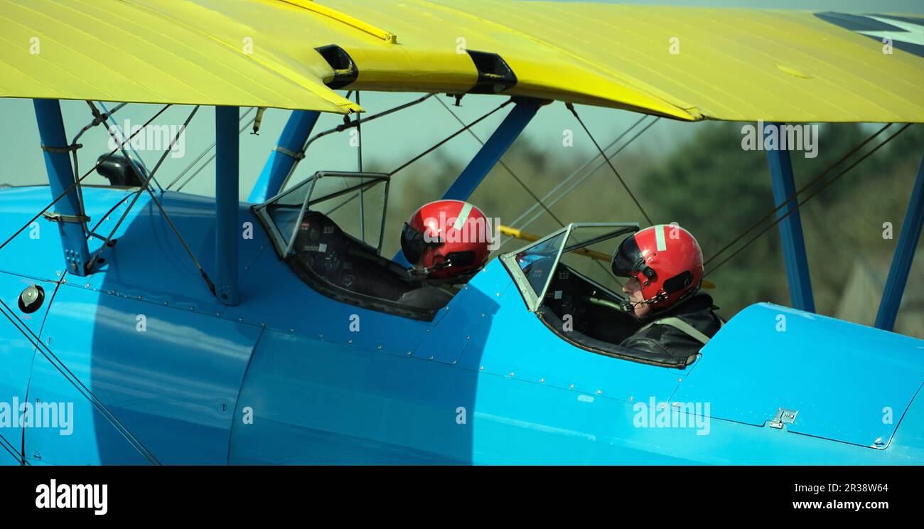 Twin seat vintage biplane about to take off Stock Photo - Alamy