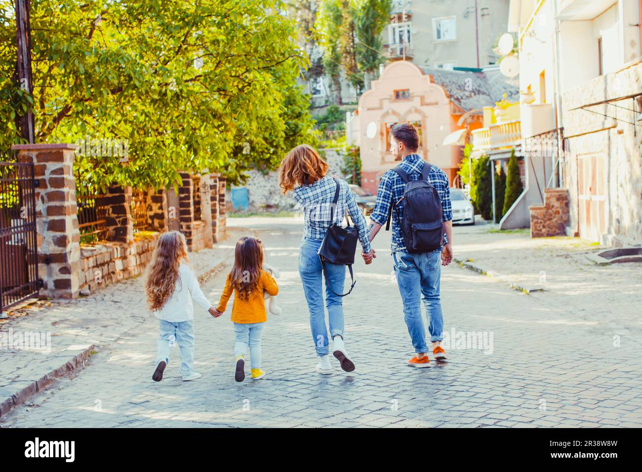 Child parents back view walking hi-res stock photography and images - Alamy