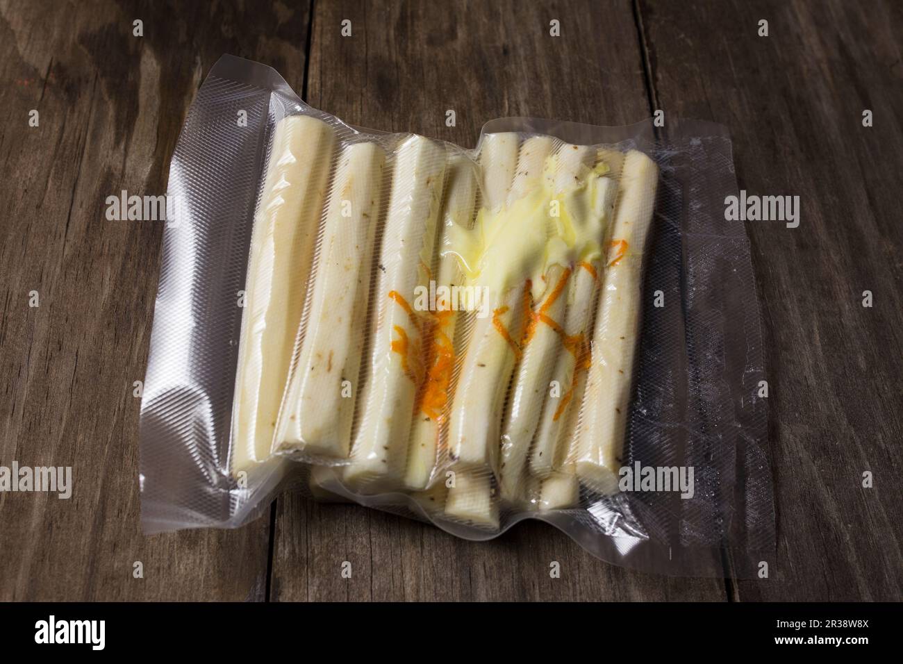 Black roots with butter and orange peel (vacuum packed Stock Photo - Alamy