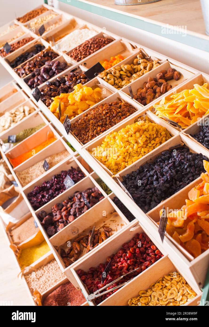 Top view of various dry fruit, raisins and nuts at the shop Stock Photo ...