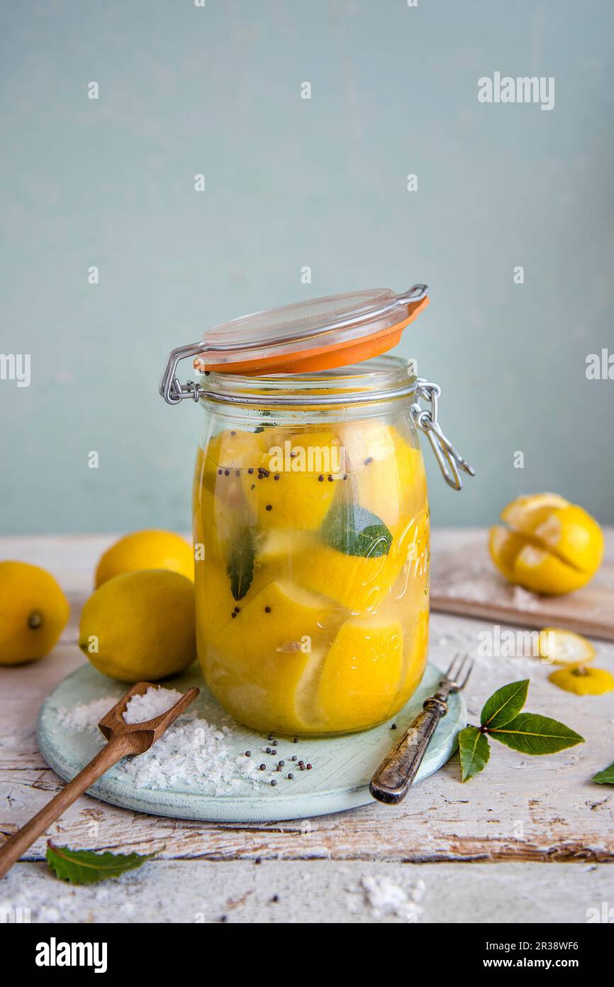 Preserved lemons (in salt) in a process of making Stock Photo - Alamy