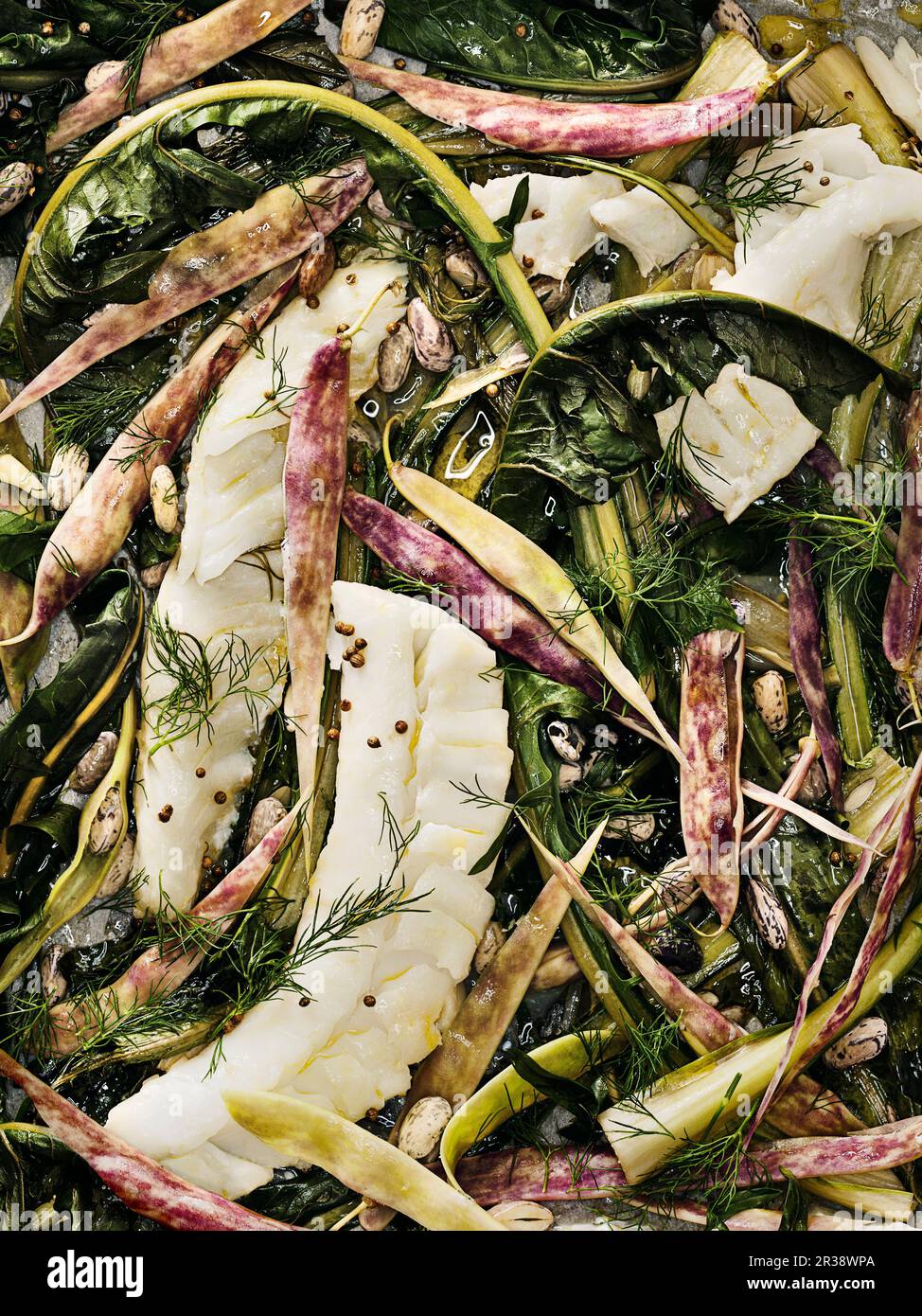 Oven-baked cod with beans, chard, mustard seeds and dill Stock Photo ...