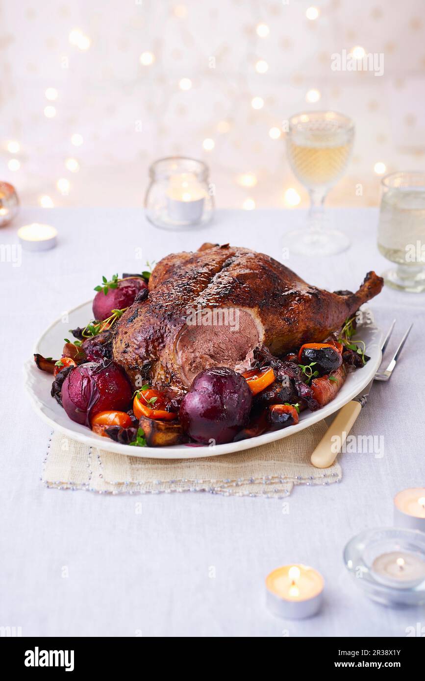 Roast duck with plums and roasted vegetables tomatoes carrots sweet ...