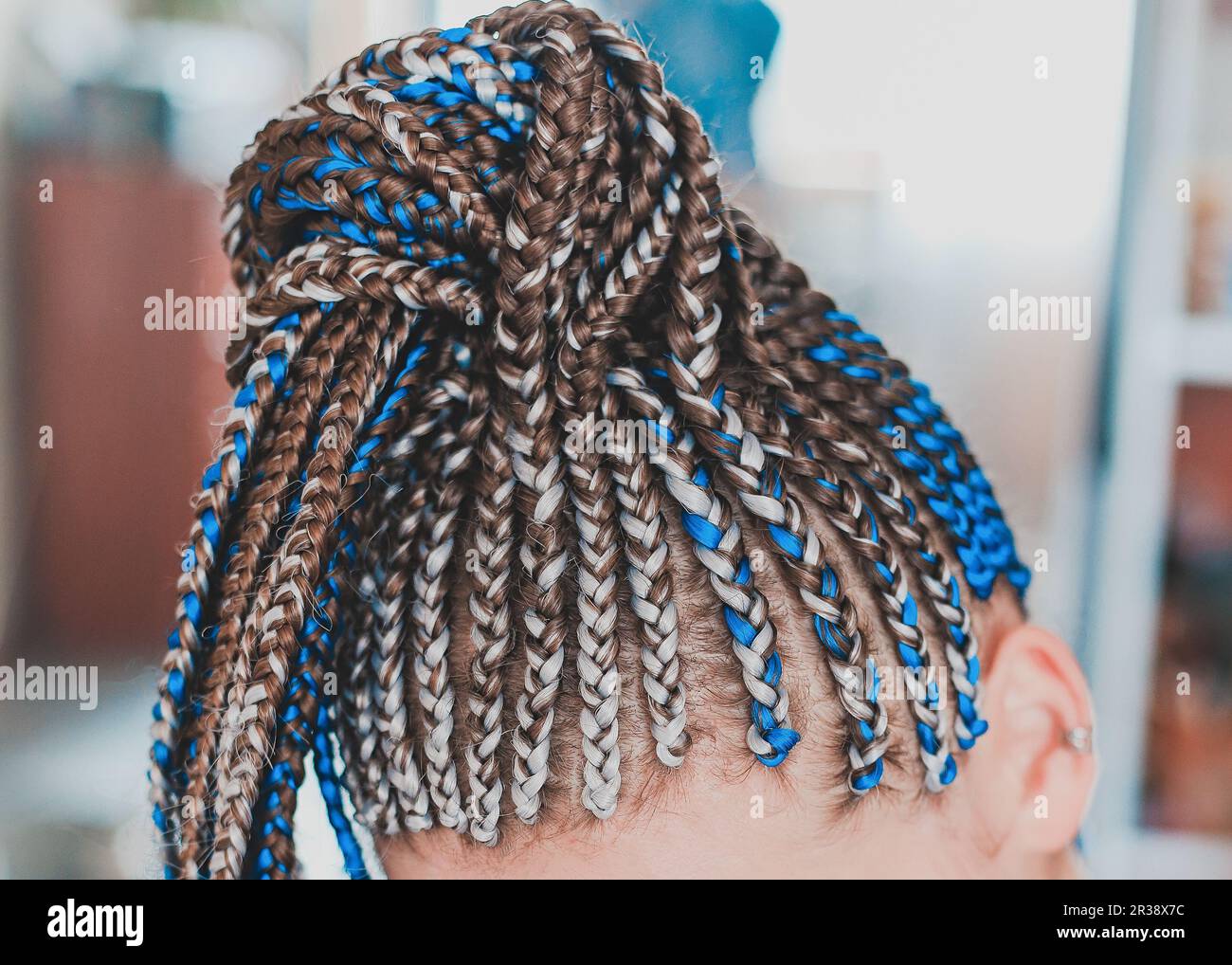 Close-up hairstyle pigtails are collected in the tail at the nape ...