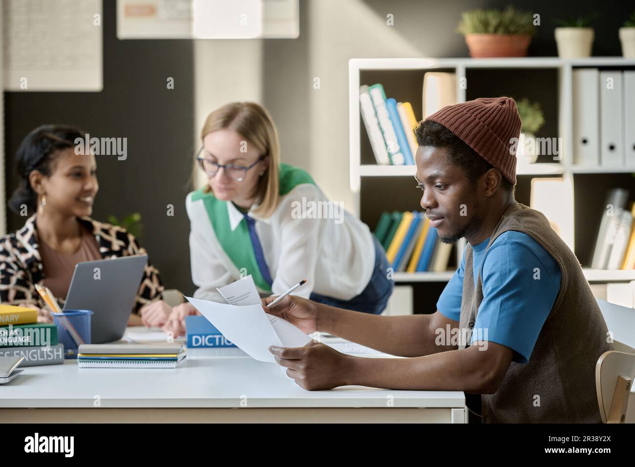 African American student studying English in English school together ...