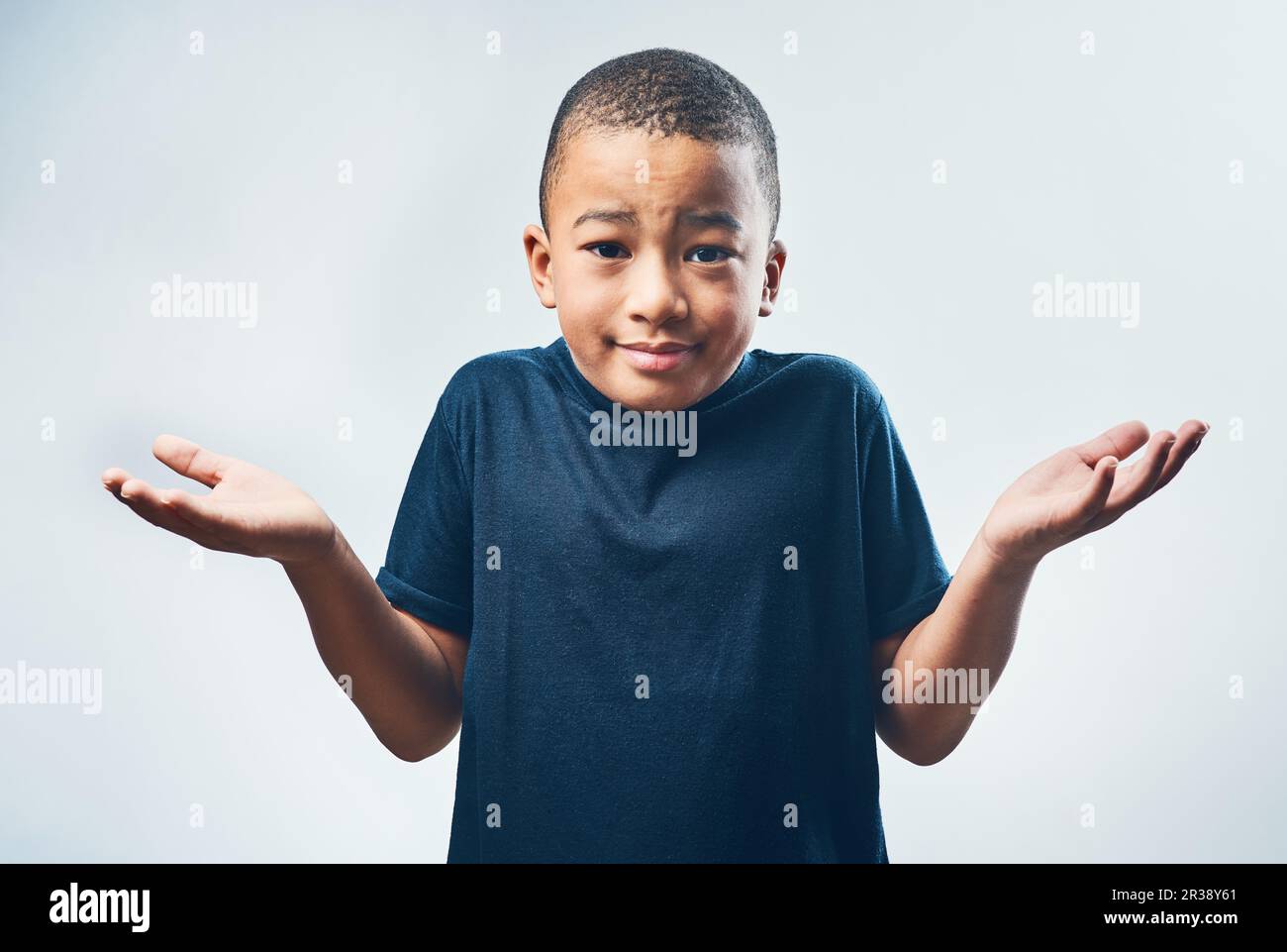 Shrugging, doubt and portrait of a child with a decision isolated on a ...
