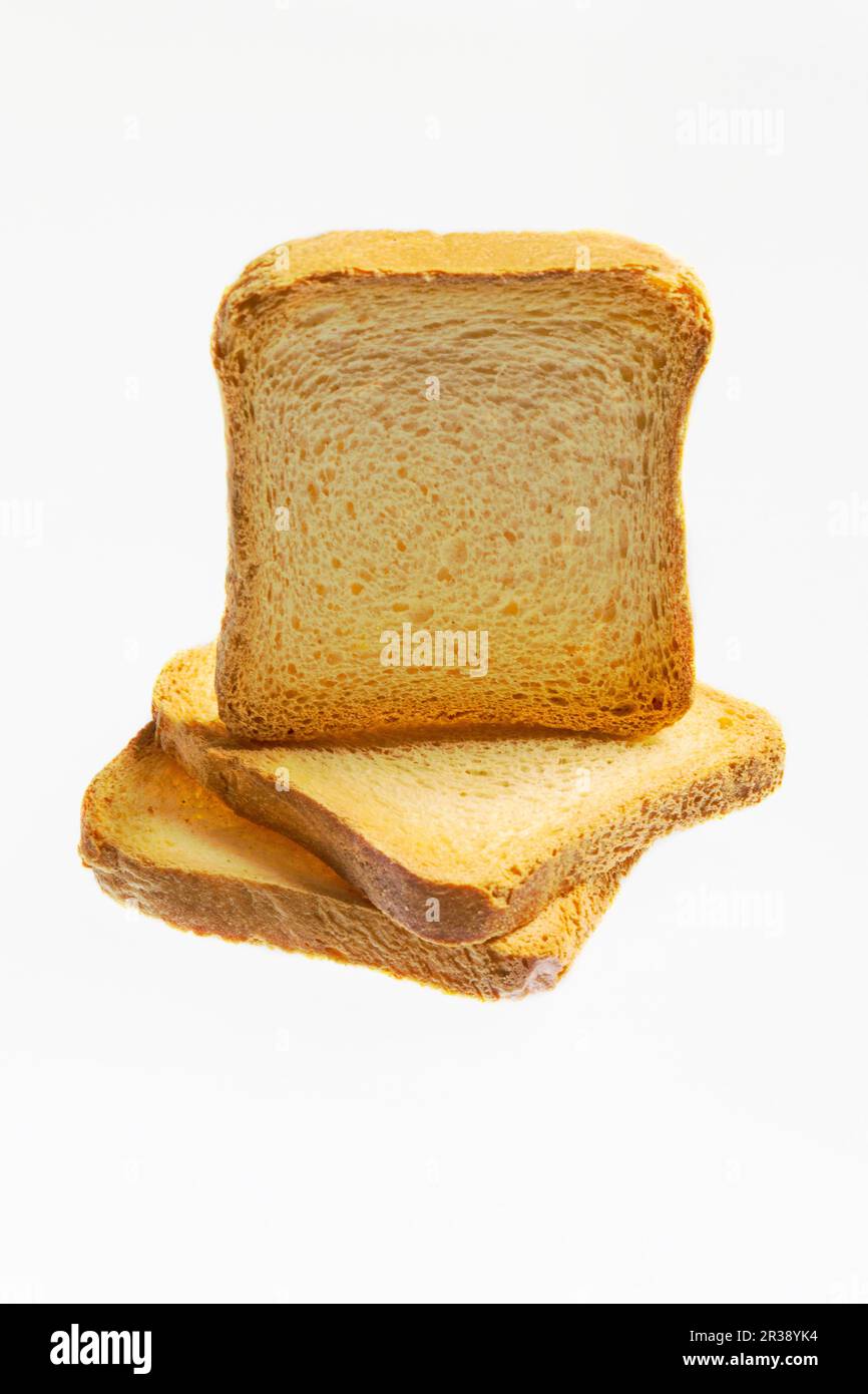 Three slices of zwieback (rusk) on white background Stock Photo - Alamy