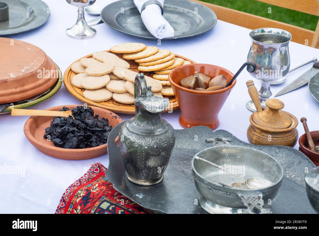 Medieval food table with biscuits fruits and pickle Stock Photo - Alamy