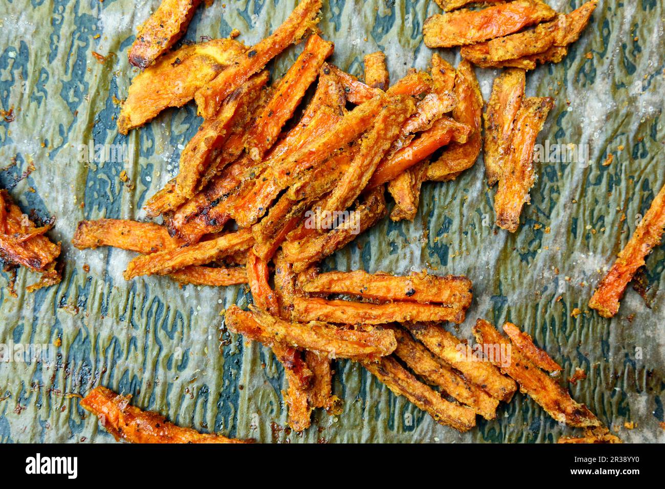 Roasted sweet potato strips with a curry crust Stock Photo - Alamy