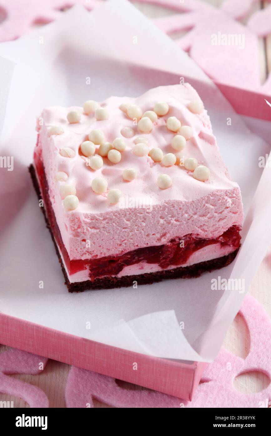 Raspberry slices with white chocolate pearls Stock Photo - Alamy