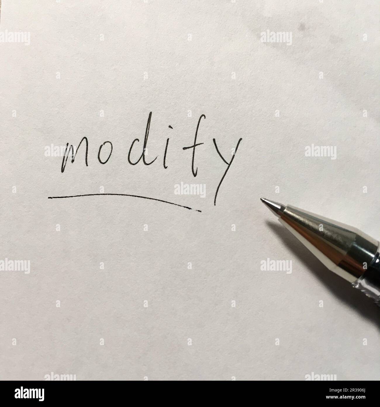 Modify concept word on paper background Stock Photo - Alamy