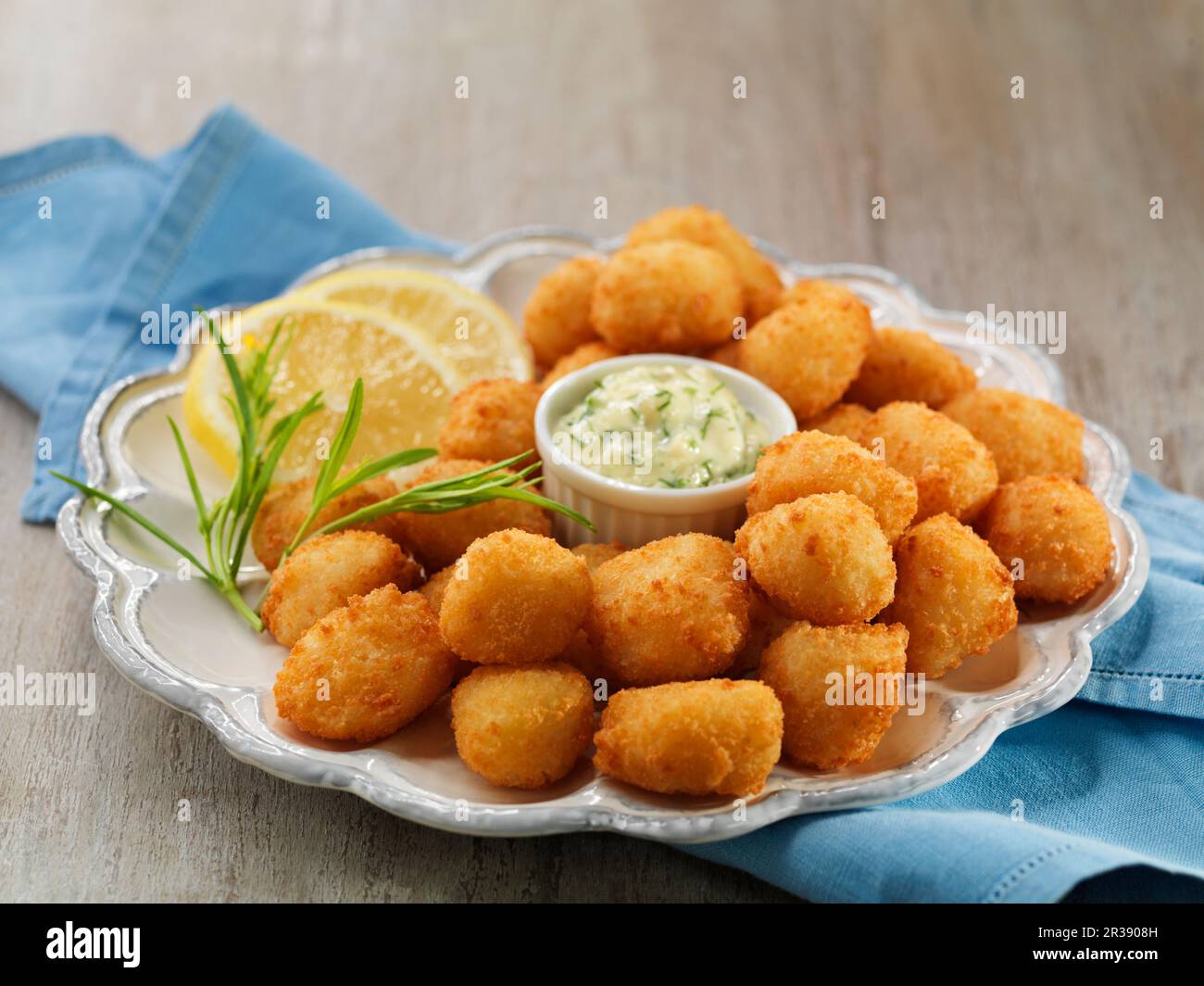Breaded scallops with a dip Stock Photo - Alamy